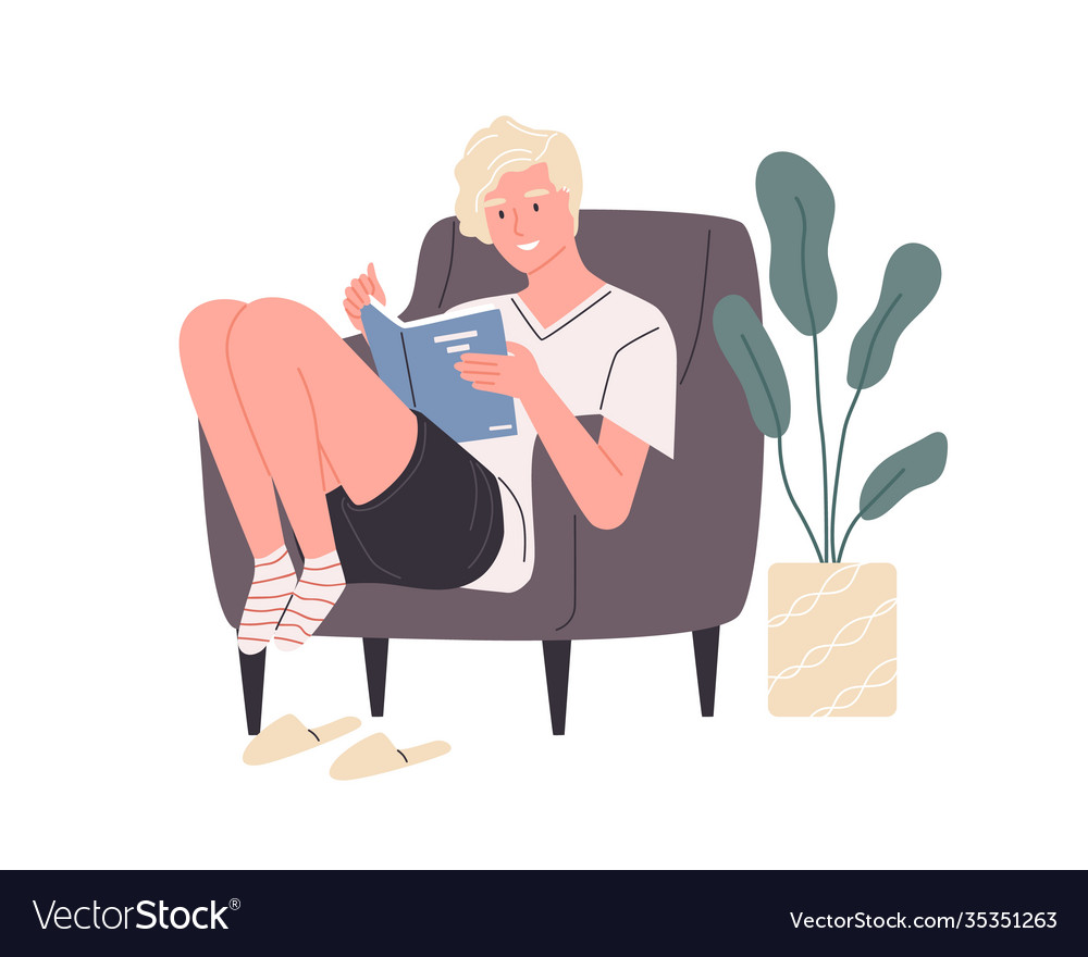 Happy young man reading book sitting in cosy chair Happy young man reading book sitting in cosy chair