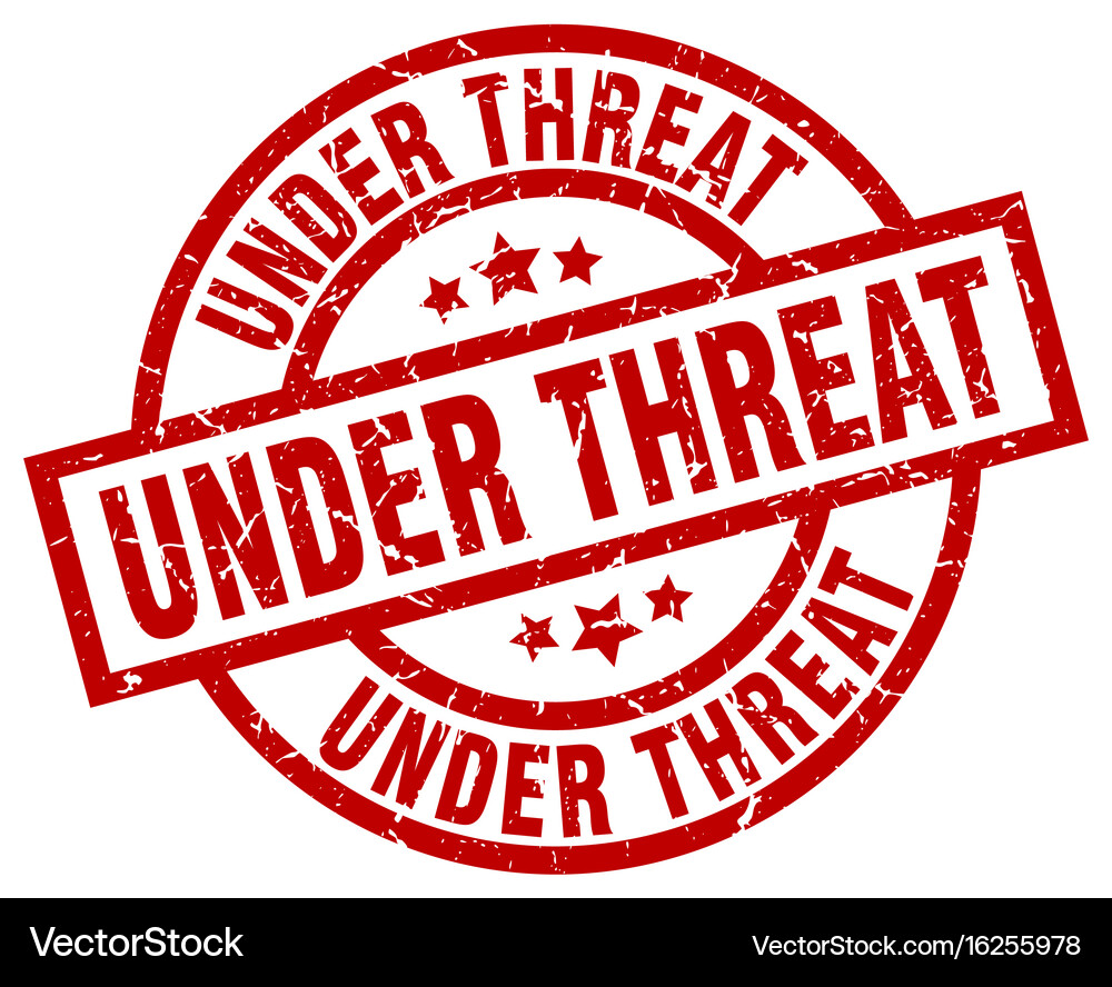 Under threat round red grunge stamp Royalty Free Vector