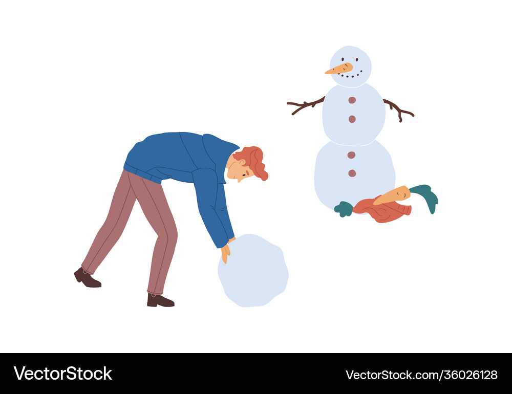 Young man rolling snowball and making snowman with