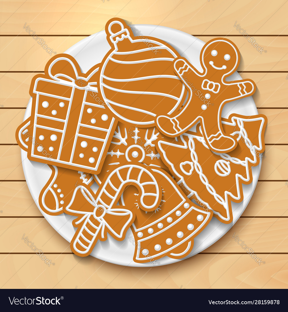 Plate with tasty christmas cookies on wooden table