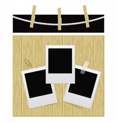 Three blank photo frames on wooden background Vector Image