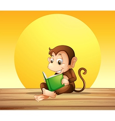 Little monkey reading a book Royalty Free Vector Image